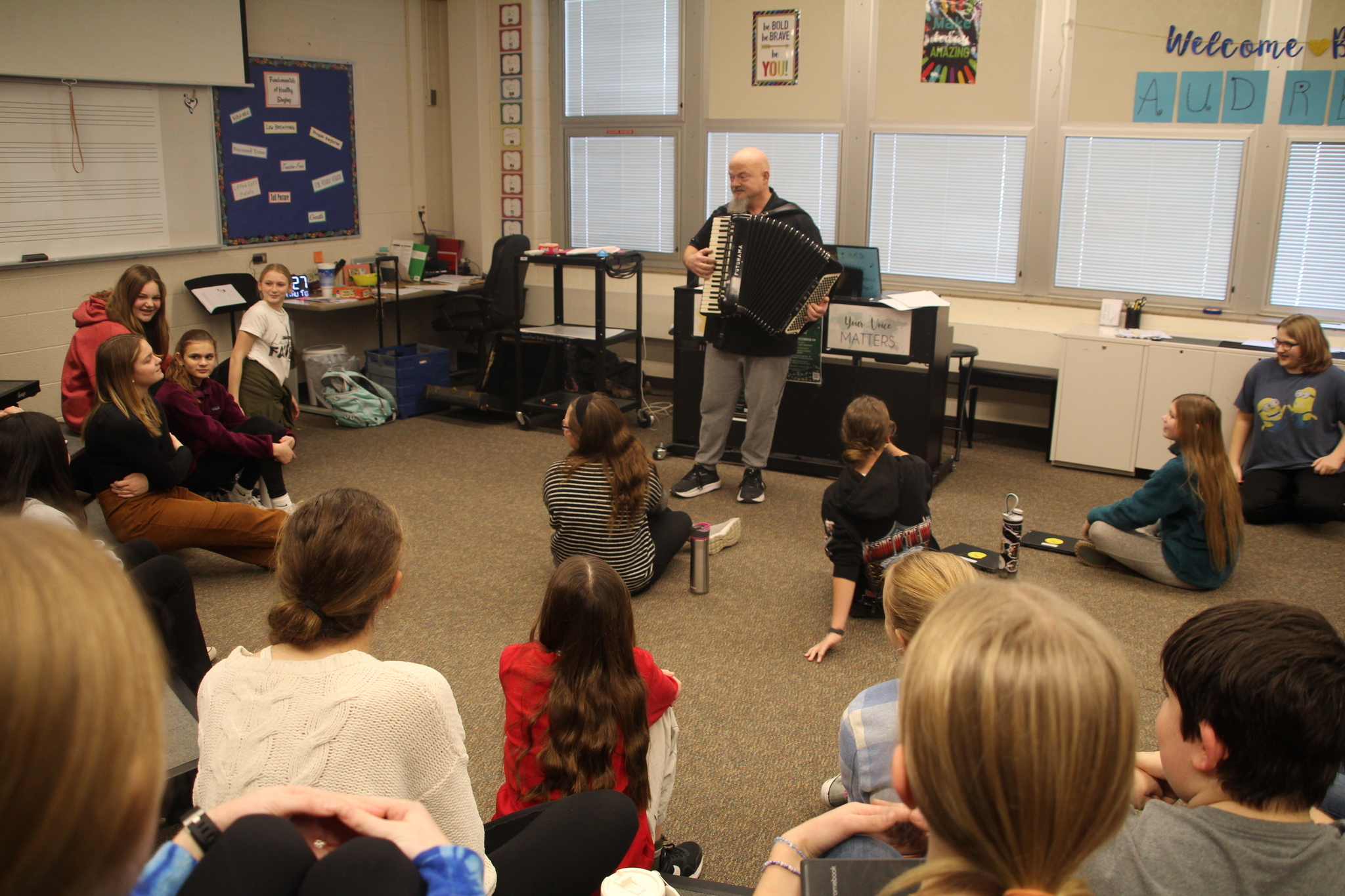 HMS teacher Bill Mousel surprises vocal music students with a lesson on ...